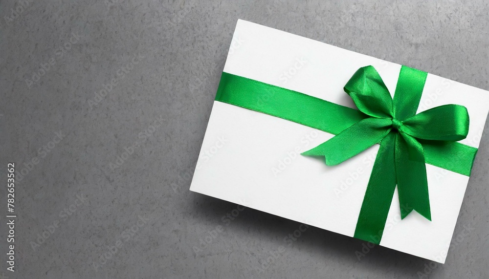 blank green gift card with a vibrant black ribbon bow right side, a ...