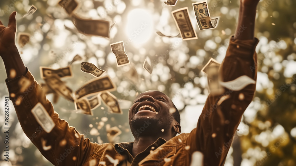 Man celebrating with money falling around him. Financial success and ...