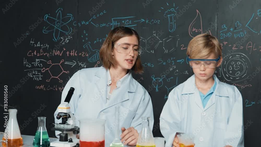Caucasian teacher explained about colored solution at science ... Caucasian teacher explained about colored solution at science ...