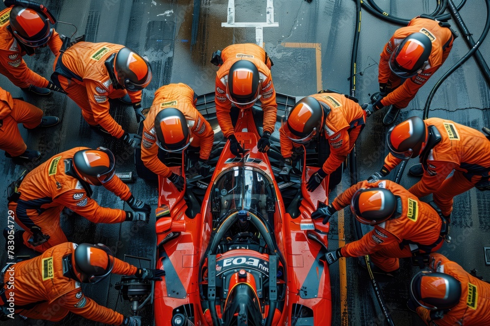 Professional pit crew ready for action as their team's race car arrives ...