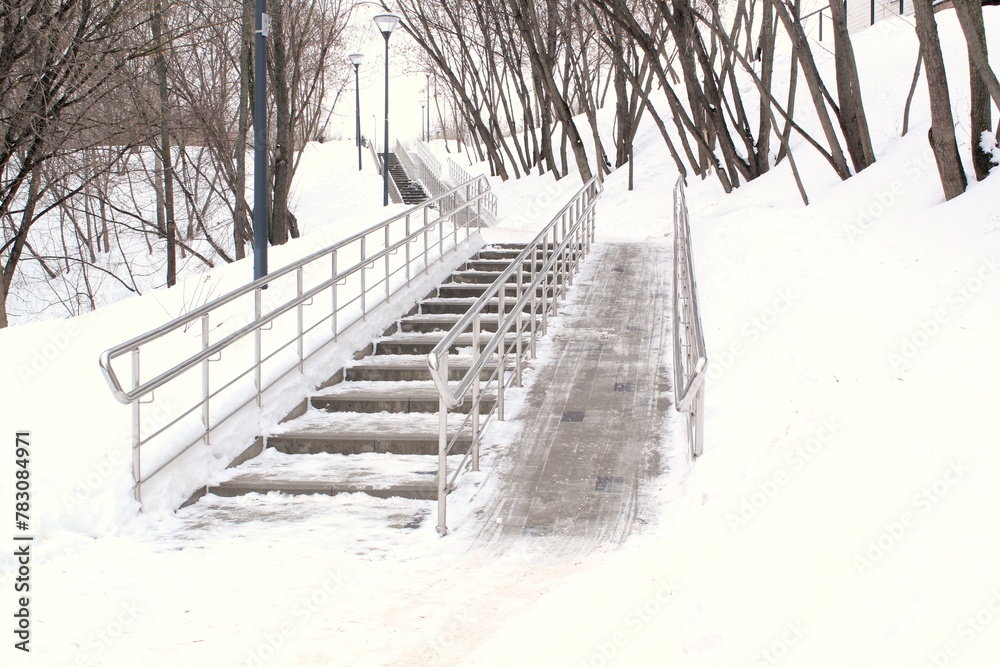 Stairs and ramp with metal railings for the passage of strollers and ...