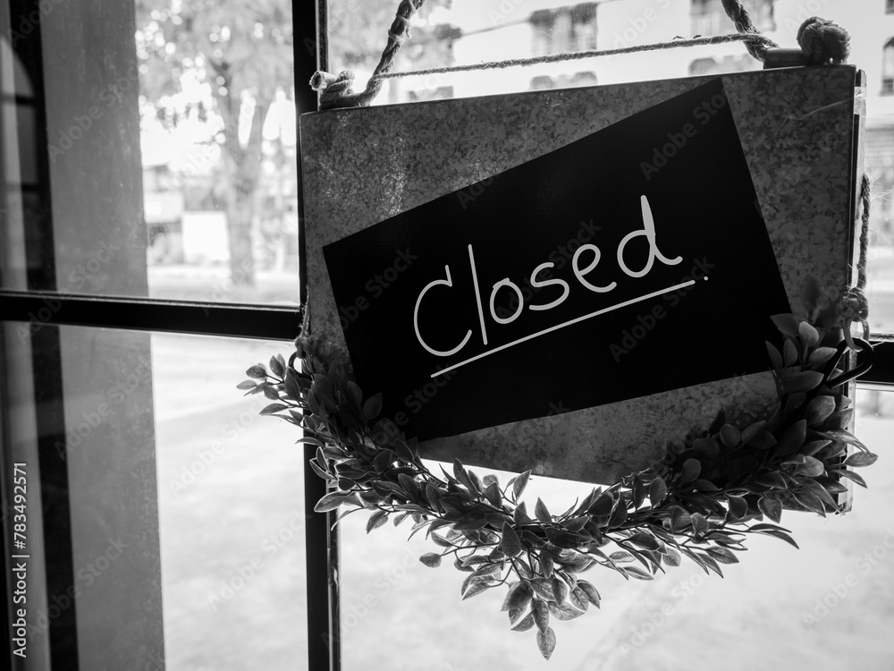 Shop closed, black notice sign with words "CLOSED !" hanging on glass ...
