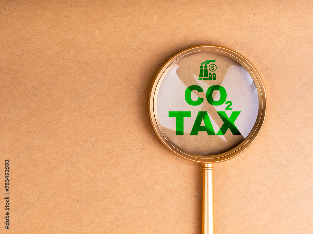 Carbon tax. Industrial factory icon and green text, "CO2 TAX" in ...
