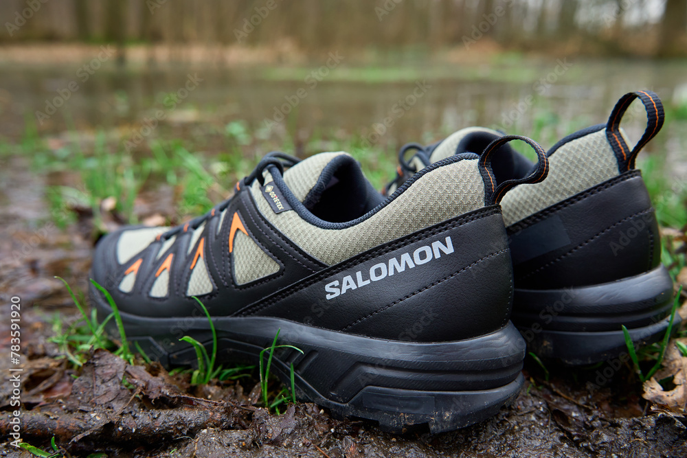Salomon X Braze GTX hiking boots with Gore-Tex membrane in water puddle ...