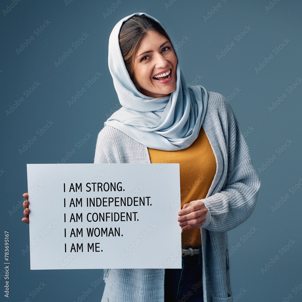 Muslim, woman and happy with poster in studio on blue background for ...