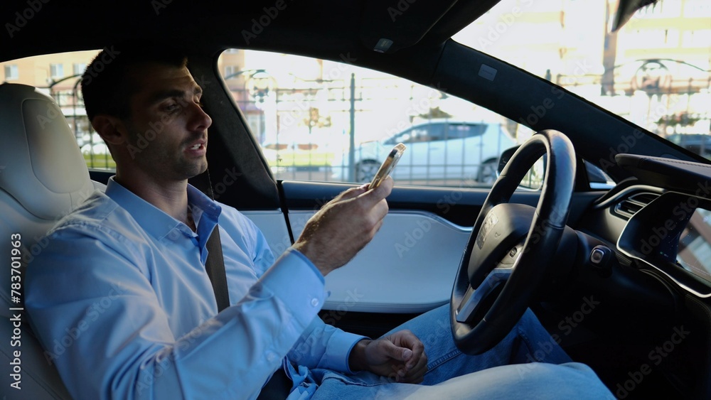 Male businessperson have serious telephone conversation while riding an ...