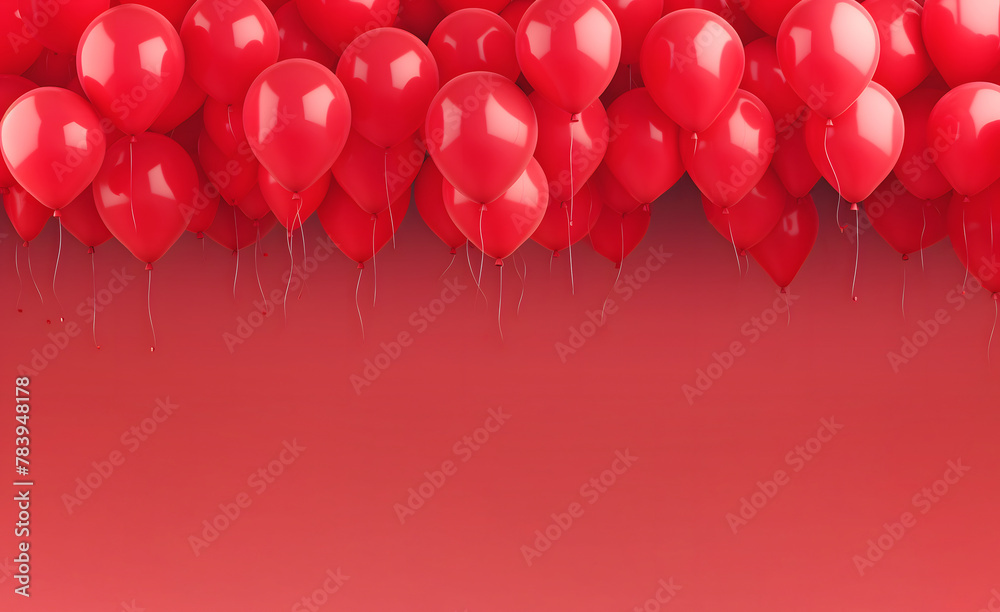 Red balloons filled with helium hang beside wall painted with same ...