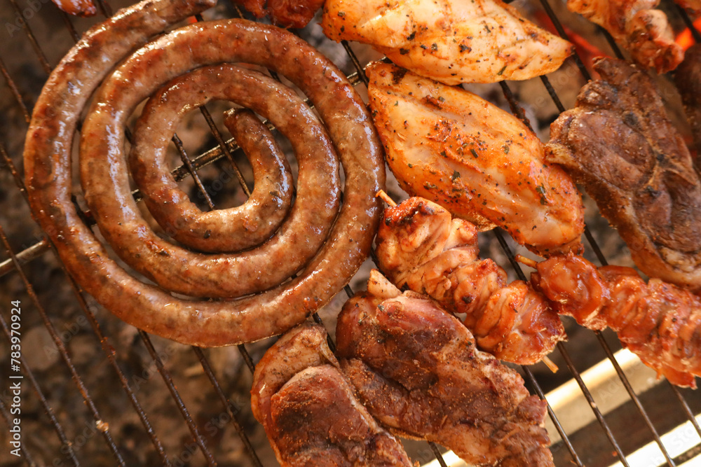 meat on the grill. South African braai meat including Boerewors ...