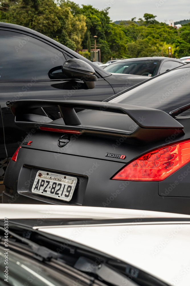 Black Nissan 370z rear end view, wing, taillight and badge focused shot ...