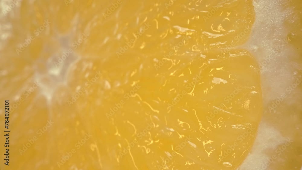 The macro photography of a sliced orange with vibrant orange color and ...