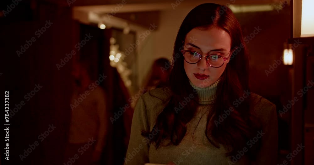 An office scene captures a dedicated employee working beyond regular ...