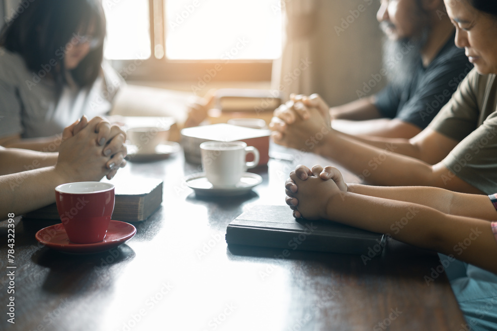 Christian woman held her Bible close as she joined hands with the group ...