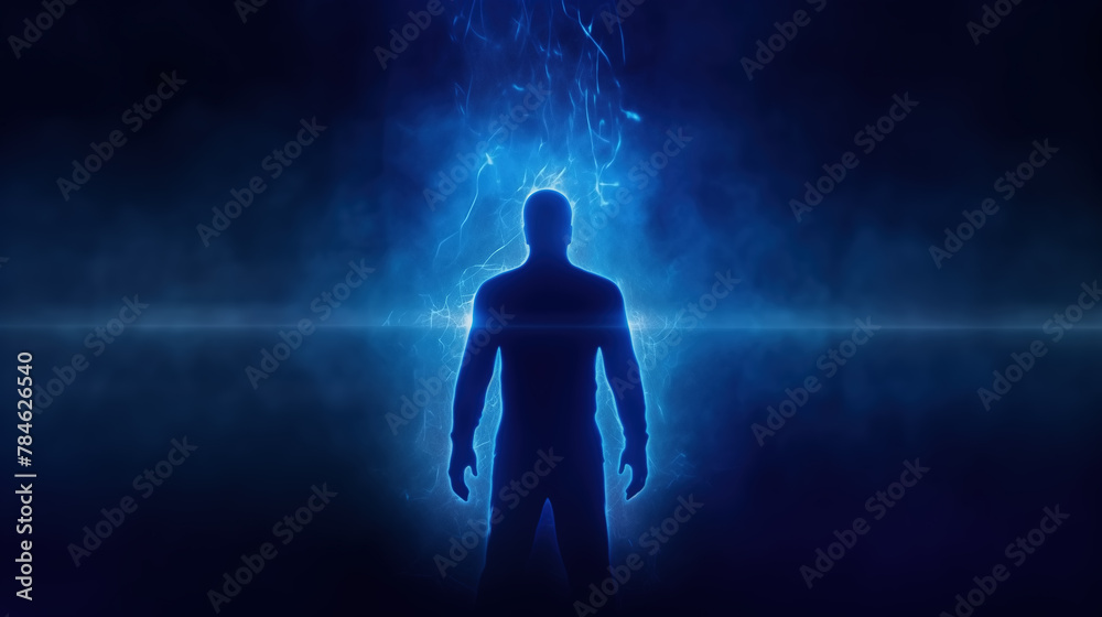 Shining blue light surrounding the person. Silhouette of a man on dark ...
