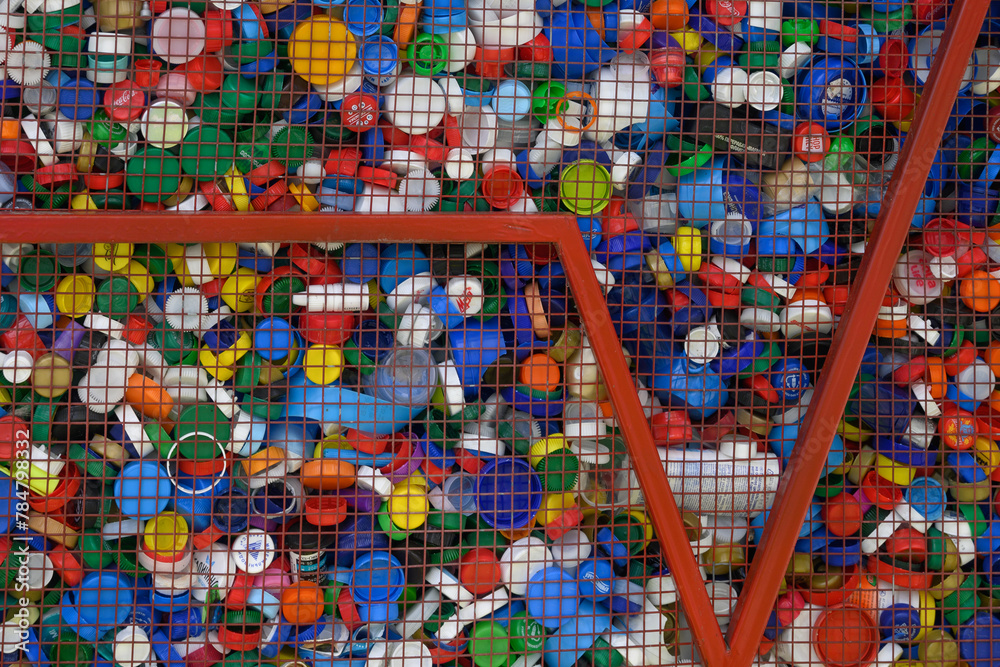 Container for collecting plastic bottle caps. Collection of plastic ...