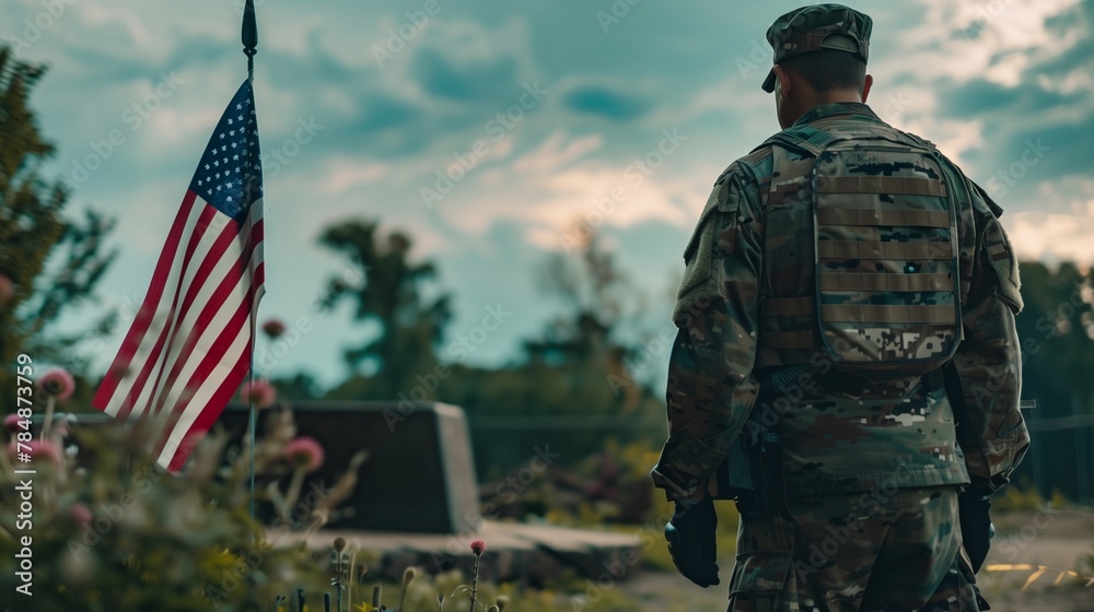 The way a military soldier salutes with a sad face at the grave with ...