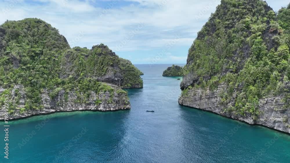 Healthy coral reefs surround rugged islands rising from Raja Ampat's ...