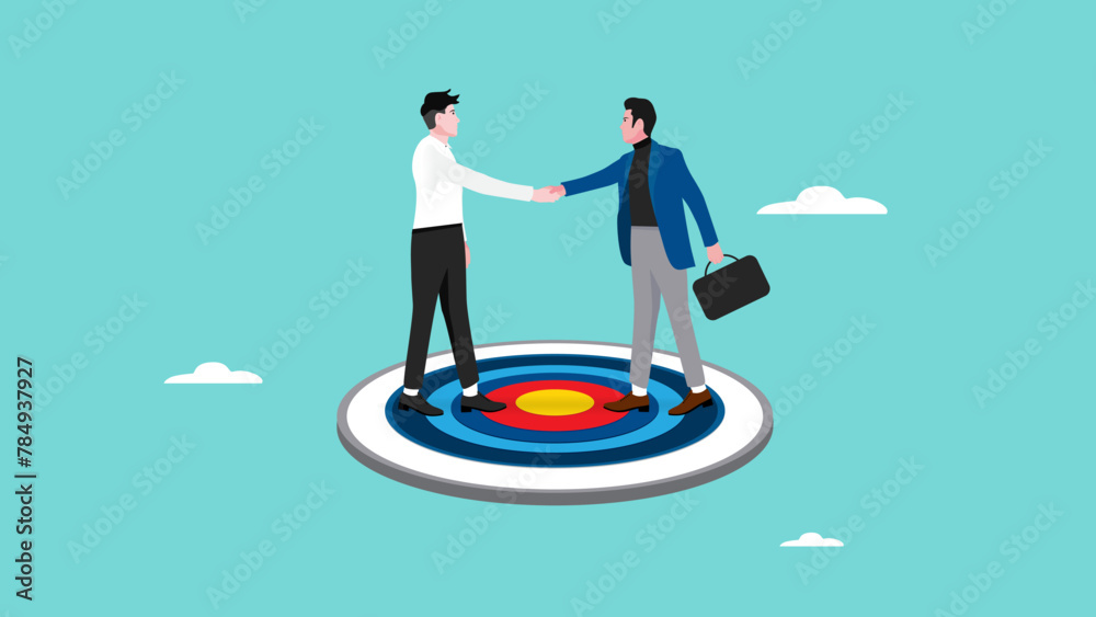 agreement to achieve common targets with two business people shaking ...