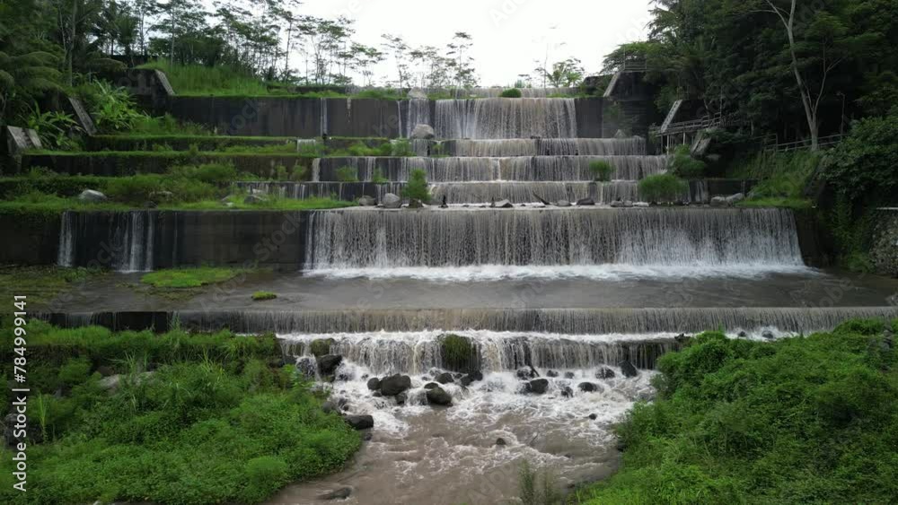 Vidéo Stock Grojogan Watu Purbo, Yogyakarta. Large multi-level dam on a ...