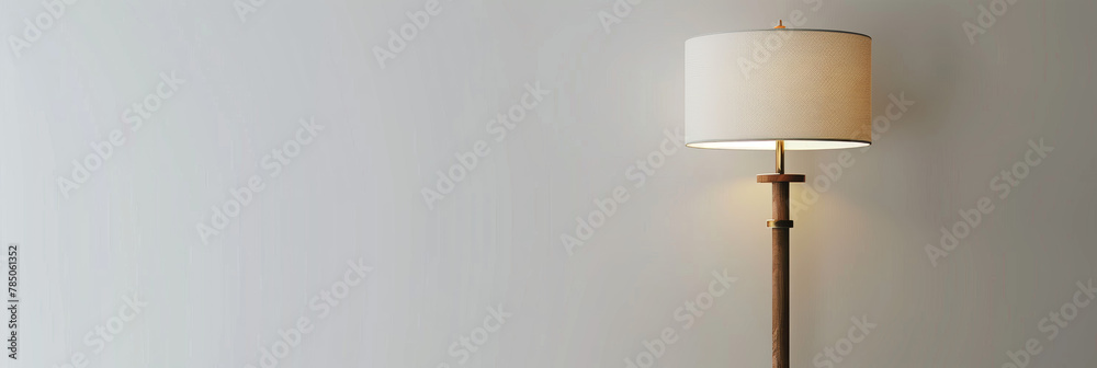 Wall-mounted textured lamp casting a warm glow over a soft white space ...