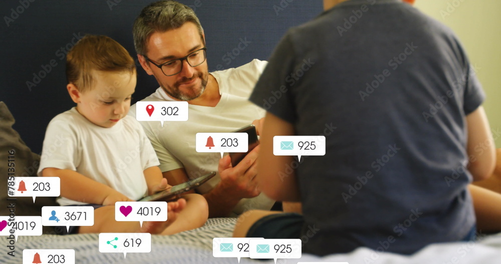 Image of notification bars over caucasian father and sons using cellphone and digital tablet ...