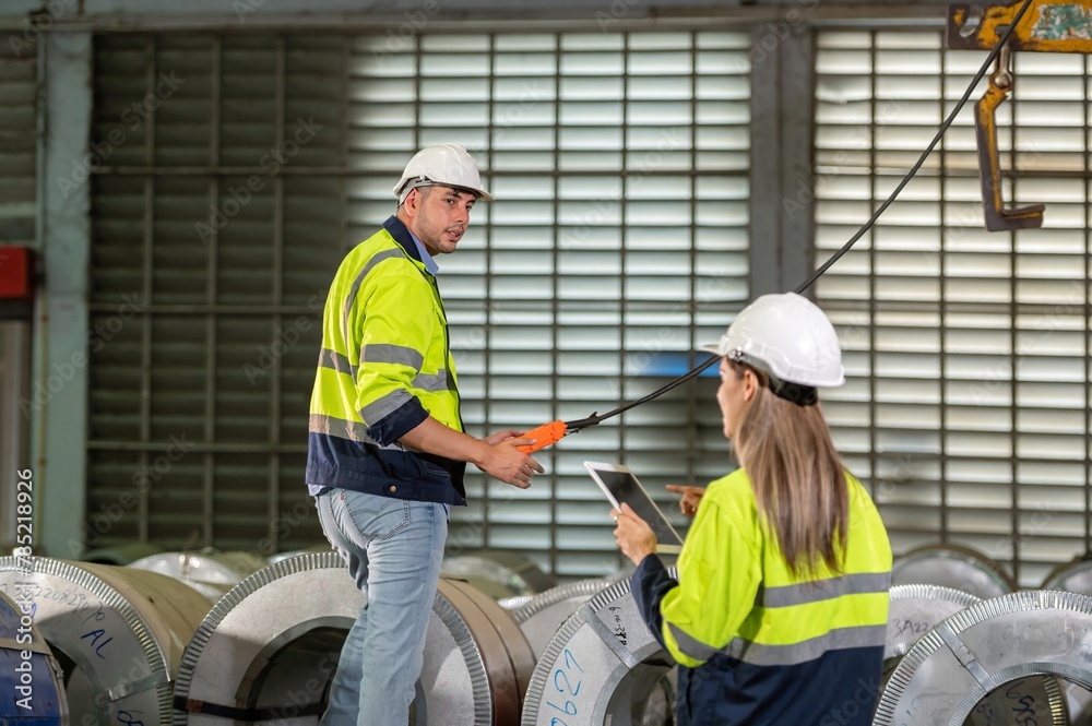 Factory apprenticeship. Woman mentor teaching man employee trainee ...