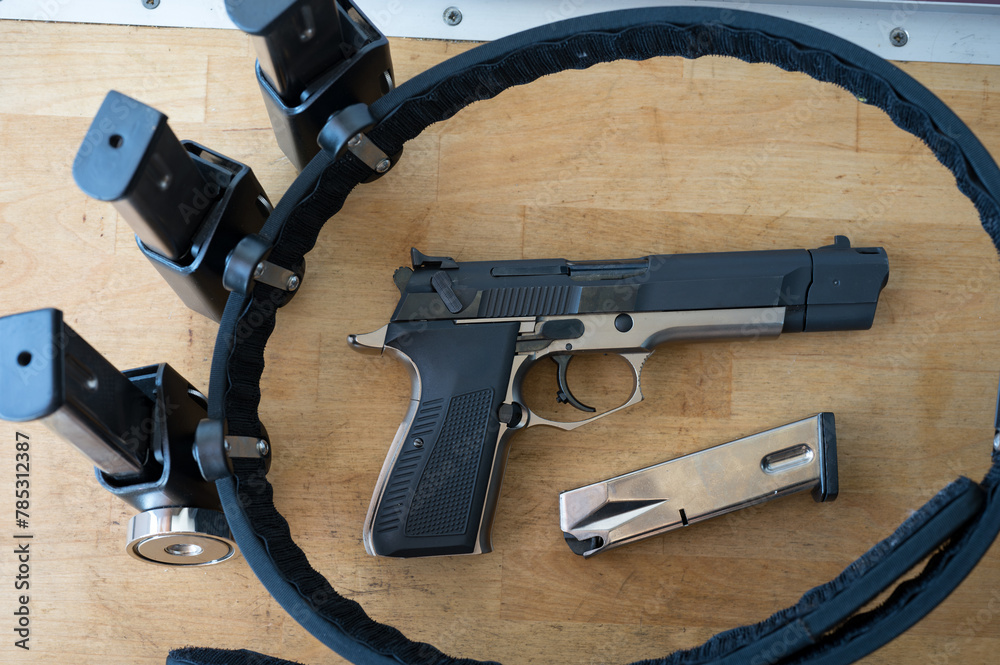 Detail of the sports equipment for IPSC, a 9mm semi-automatic pistol ...