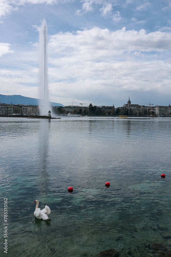 Jet d'Eau Geneva Fountain with city and mountains in the background and ...