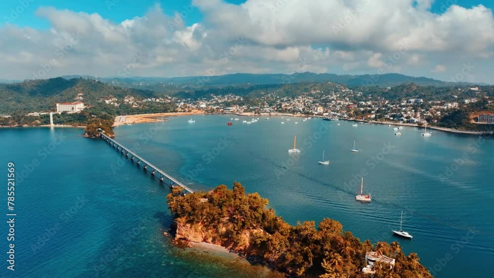 Bright spring view of a tropical island. A road over the sea connecting ...