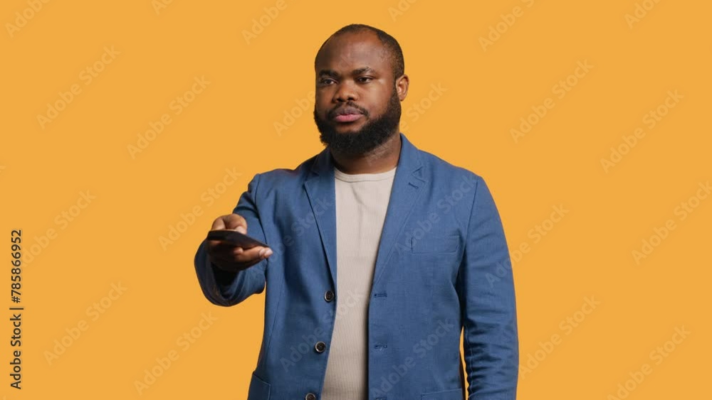 Vidéo Stock Man zapping through channels, watching news broadcast ...