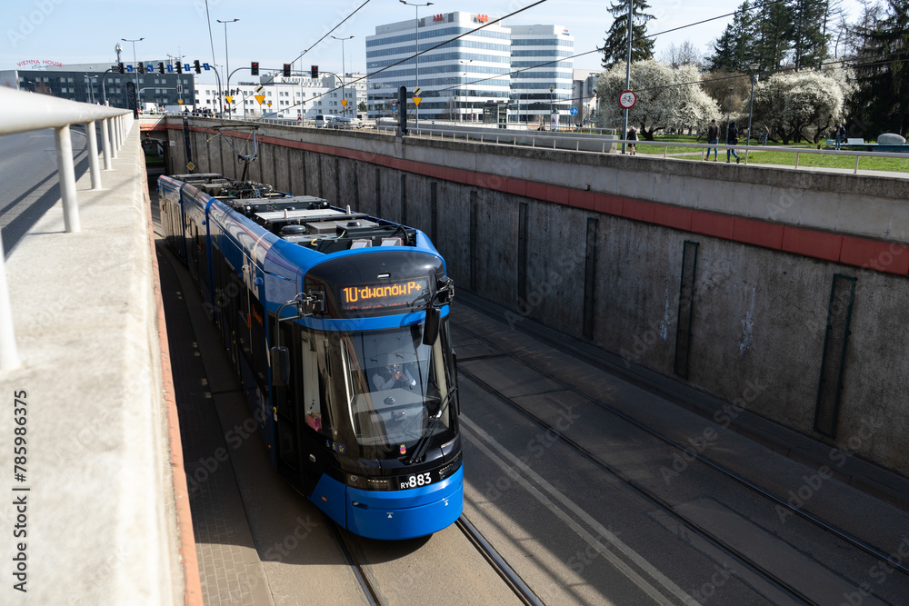 Stadler Tango Lajkonik type tram wagon leaving lower level of Rondo ...