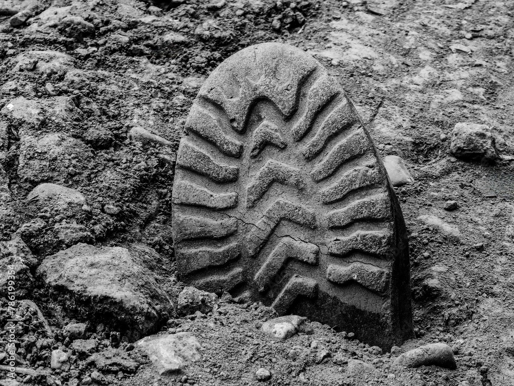 Unearthing the Past. Military Boot Buried in Time . Exploring War ...