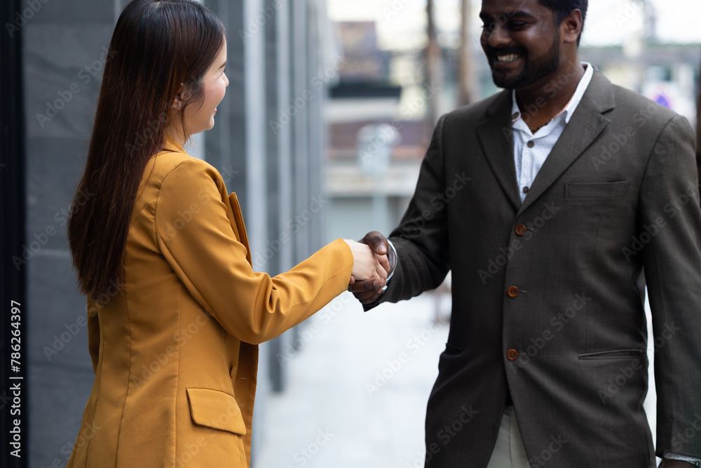Successful business people handshake - Asian business woman and indian ...