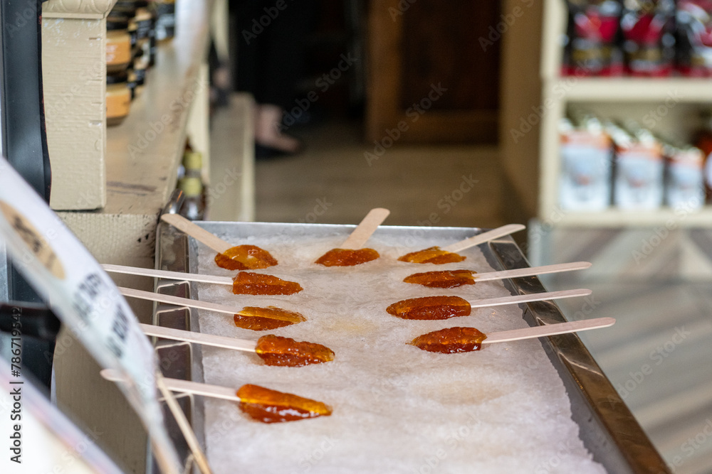 A traditional Canadian sweet candy made of boiled maple sap laid on a ...