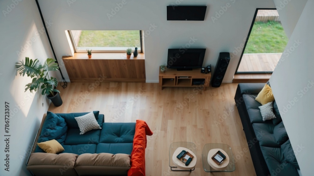 An overhead view of a living room with a couch and a television ...