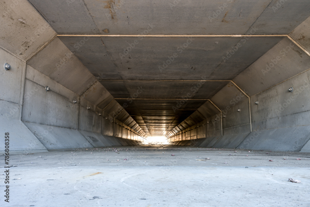 Focus stacked image inside a concrete box culvert under a road for ...