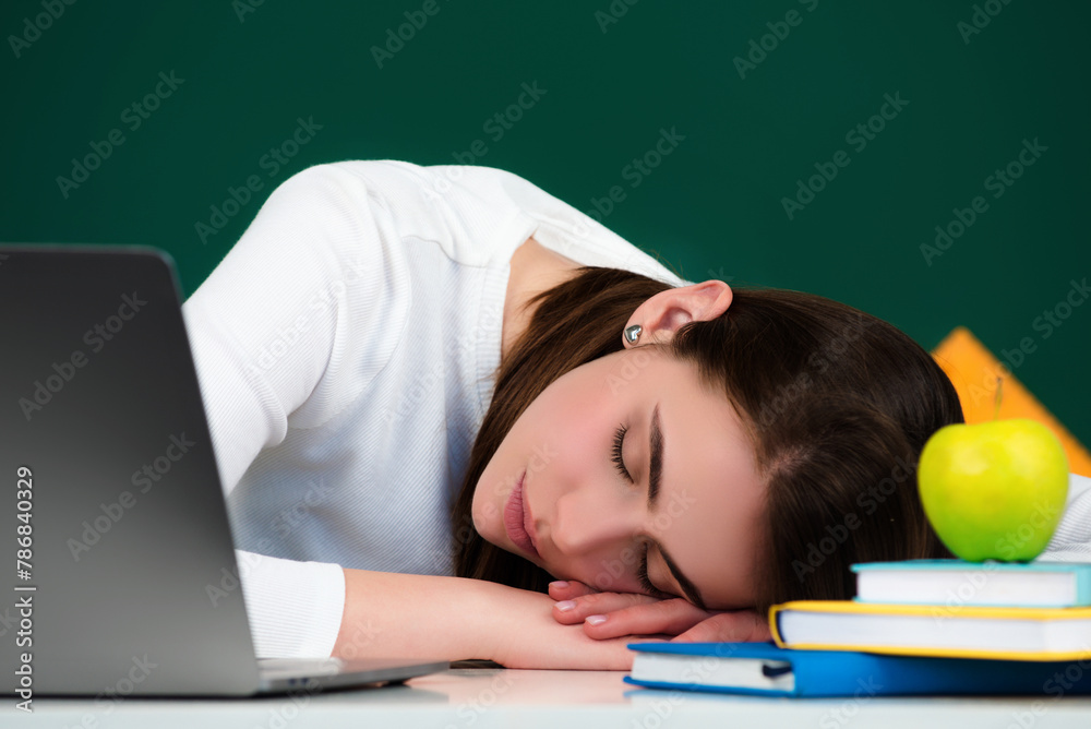 Student sleeping during a lecture in a classroom. Portrait of tired ...