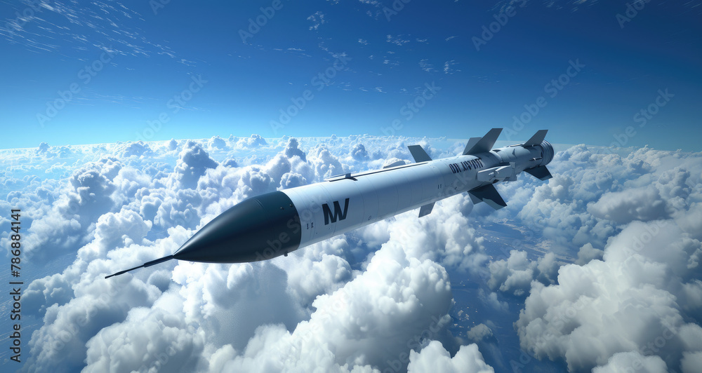 An aerial view of an air-to-air missile in flight, showcasing its sleek ...