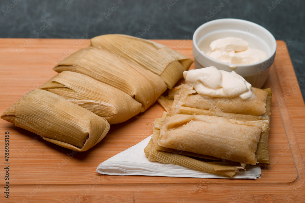 Central American tradition: savory tamales wrapped in corn leaves ...