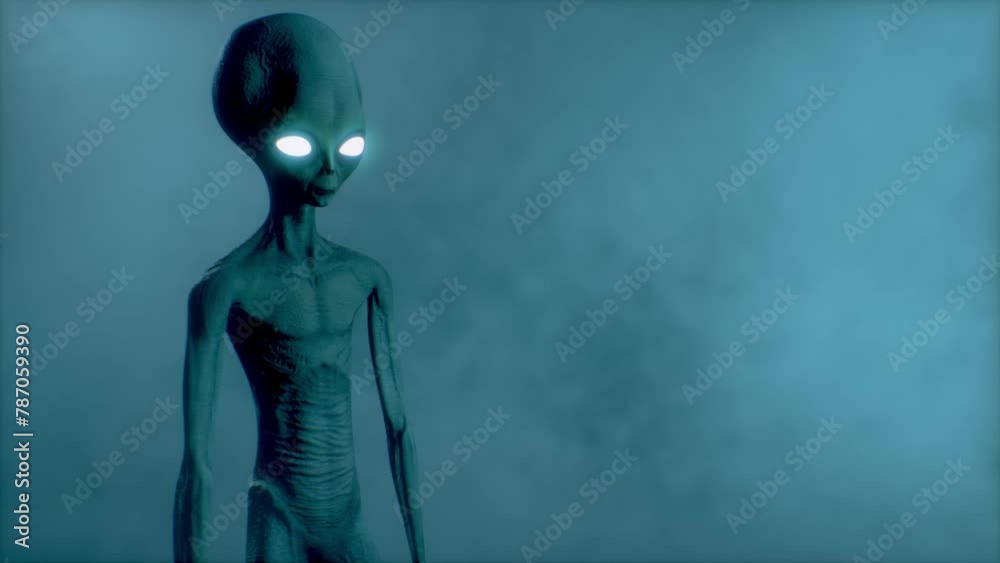 Scary gray alien standing and blinking at the dark foggy background of ...