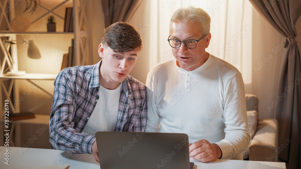Family help. Internet leisure. Happy rest. Supportive son teaching ...