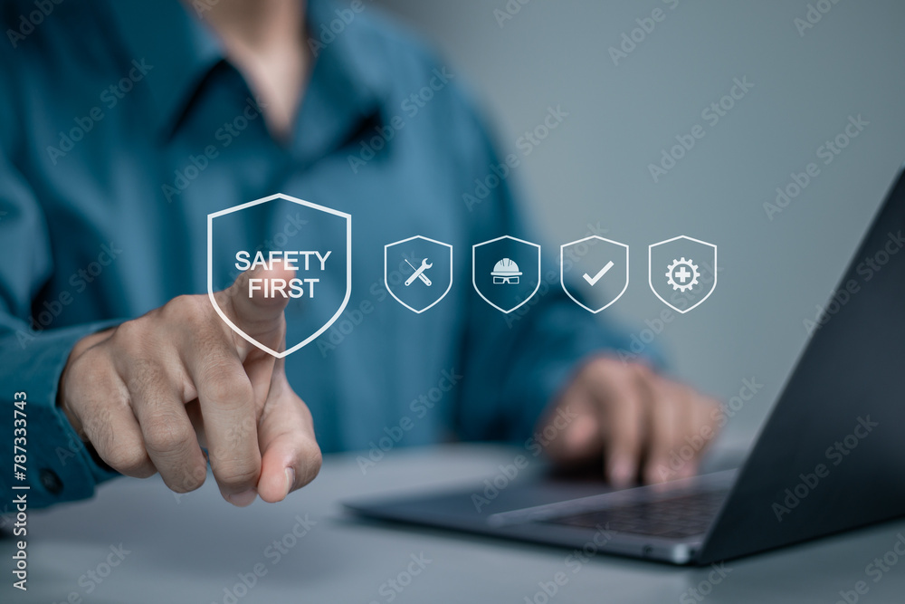 Safety first concept. Businessman using with safety first symbols for ...