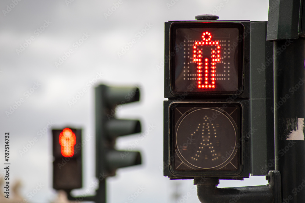 Red pedestrian crossing traffic light with blurred background of ...