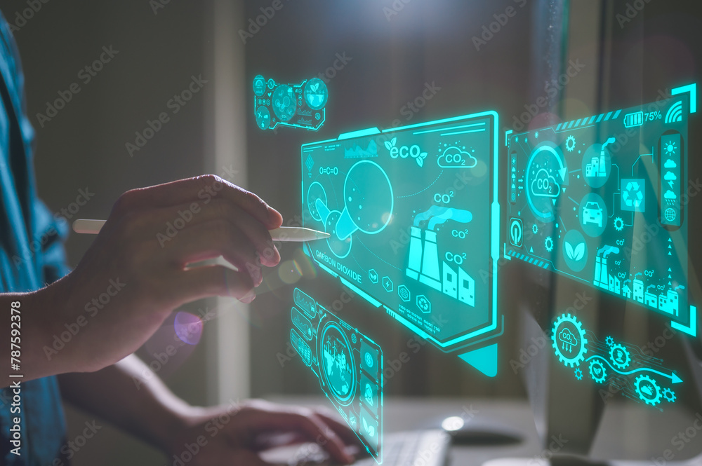 Man hand using computer and pen with virtual modern reduce co2 emission ...