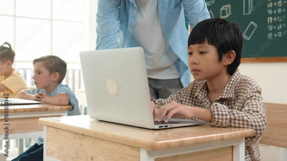 Caucasian teacher helping asian student coding engineering prompt while ...