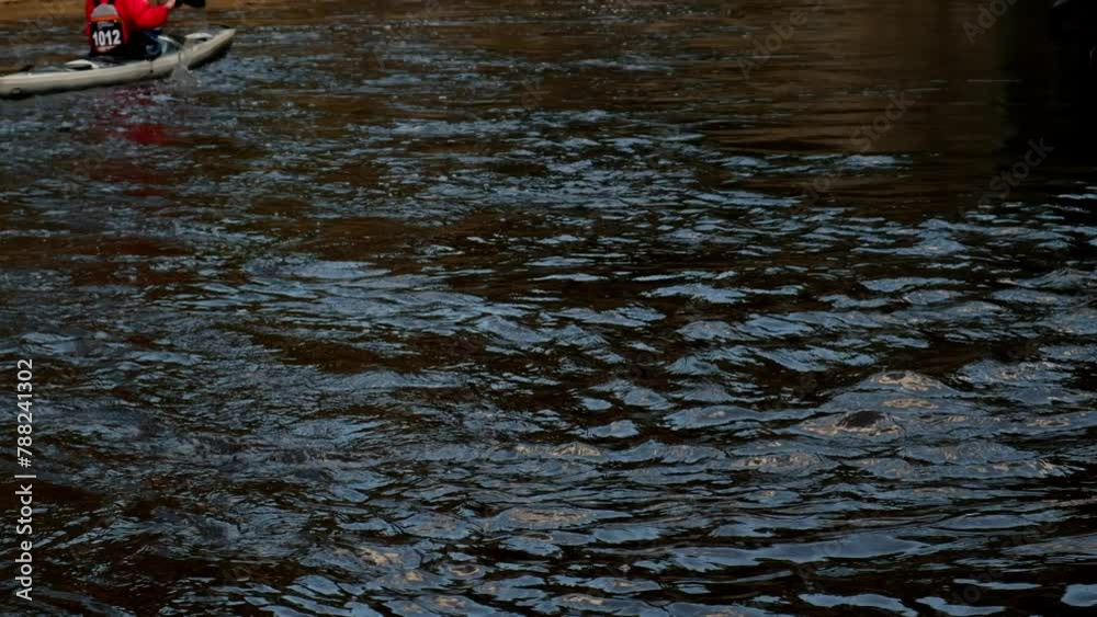 Canoeing, a type of rowing sport, follow of dual kayak going down the ...