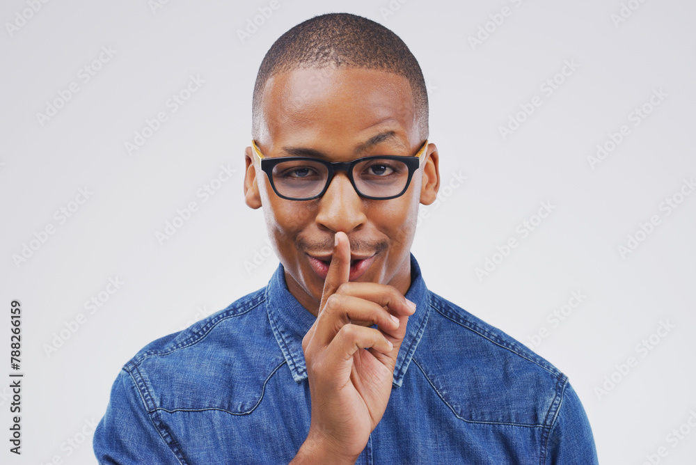 Portrait, silent and shush with private black man in studio isolated on ...