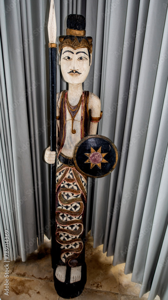 Bali March 2024 – Traditional wooden balinese statue of a worrior ...