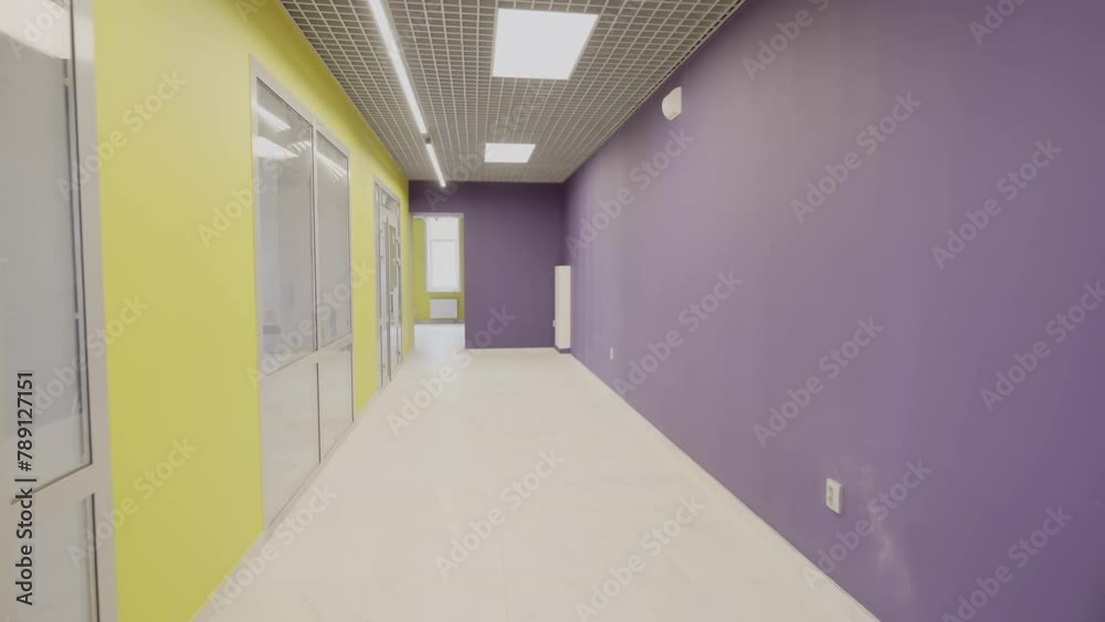 Office corridor painted in different colors after renovation. Each wall ...