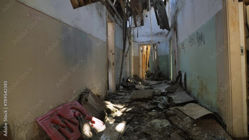 An eerie corridor in an abandoned building with signs of extreme ...