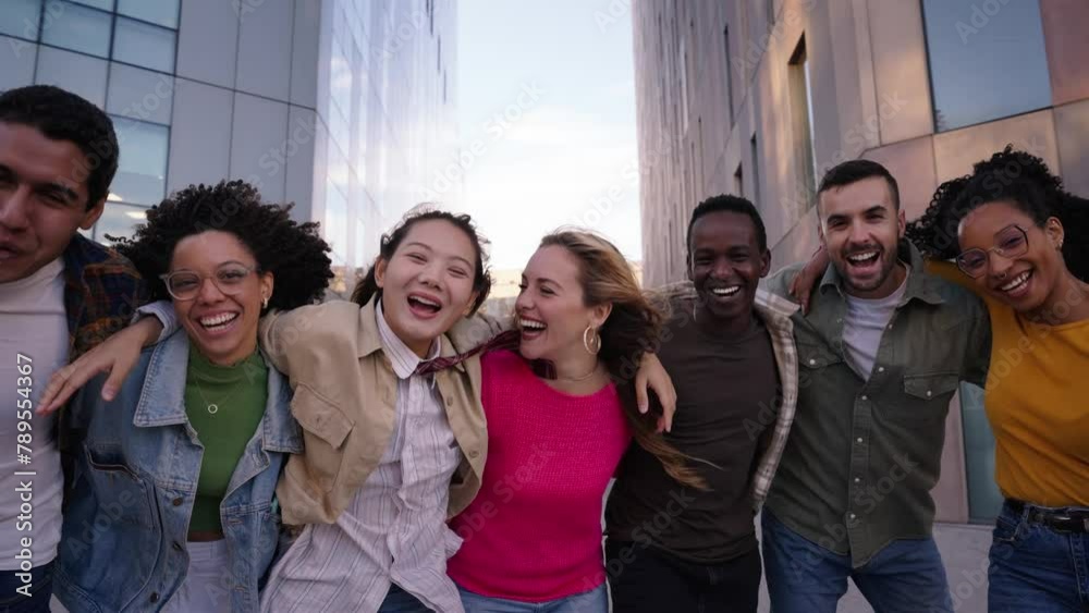 Group of diverse excited young gen z people embracing posing laughing ...